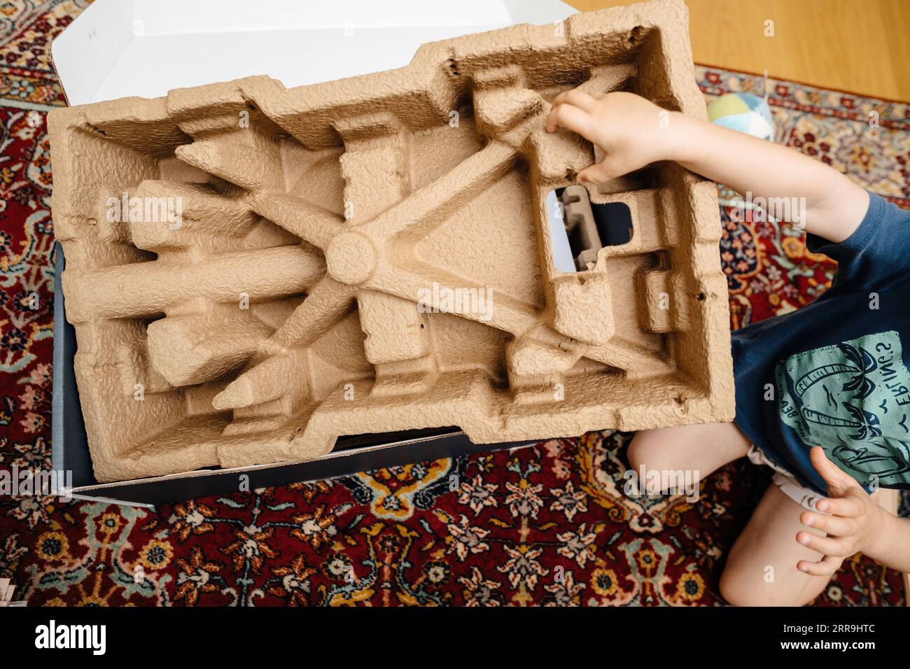 Bremen, Germany - Aug 14, 2023: A curious child unboxes a SpaceX ...