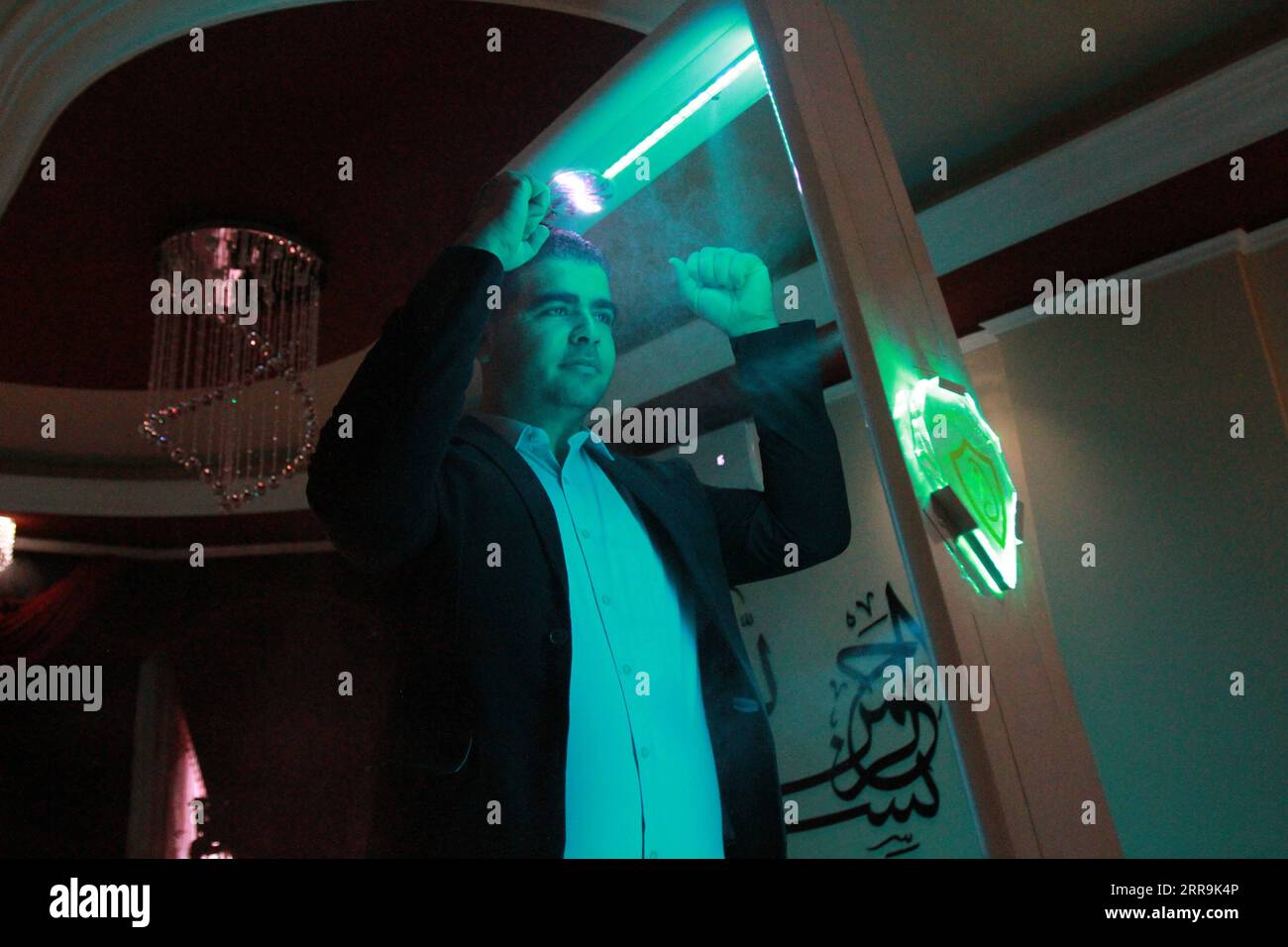 210620 -- BEIRUT, June 20, 2021 -- Amer Darwish shows his invention, a ...