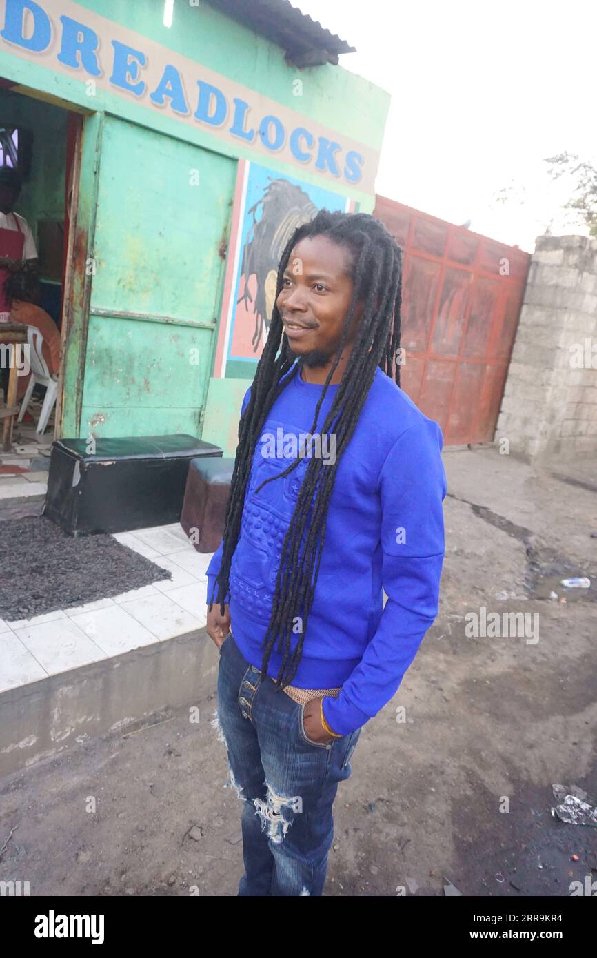 210621 -- LUSAKA, June 21, 2021 -- Caesar Ntalasha, proprietor of Caesar Dreadlocks, poses for a ...
