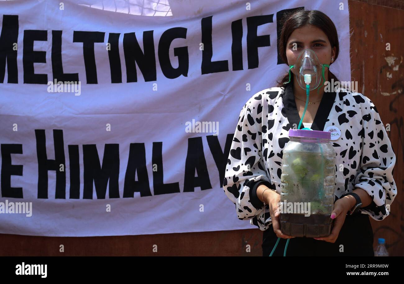 Lalitpur, Nepal. 7th Sep, 2023. A Climate Activist wears an oxygen mask ...