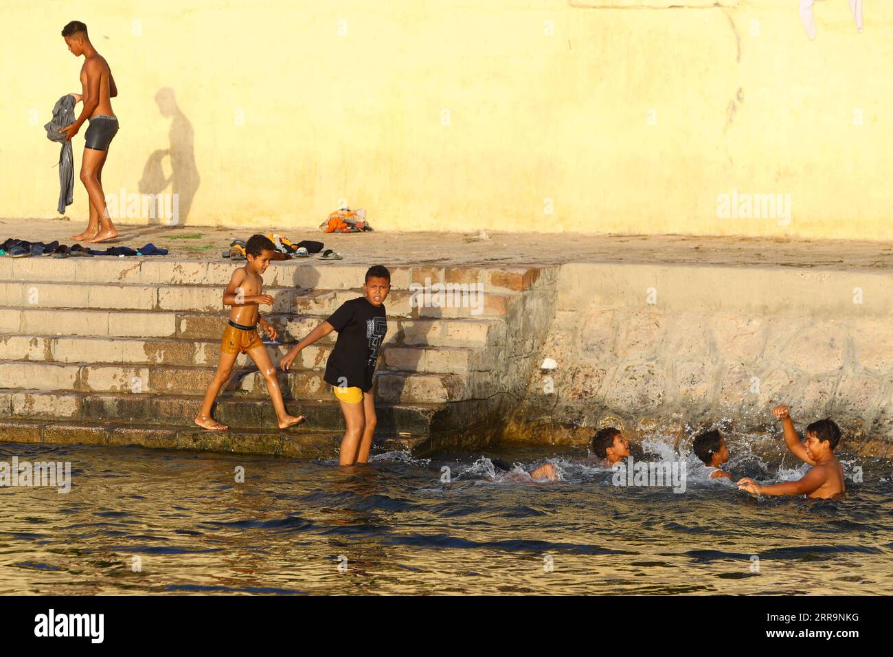 210625 -- ASWAN EGYPT, June 25, 2021 -- Children cool themselves in the ...