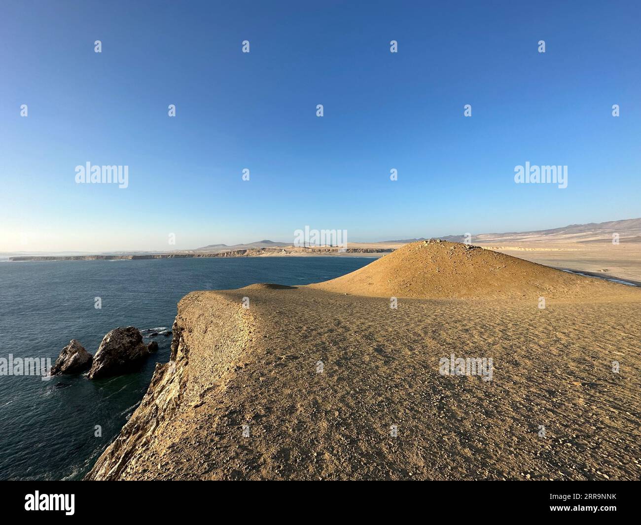 The beautiful landscape of Peru, with rocky cliffs silhouetted against ...
