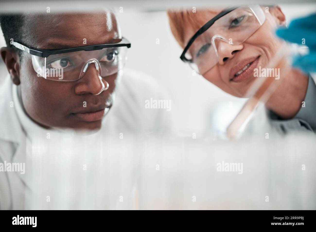 Teamwork, medical and scientists with research, test tube and ...