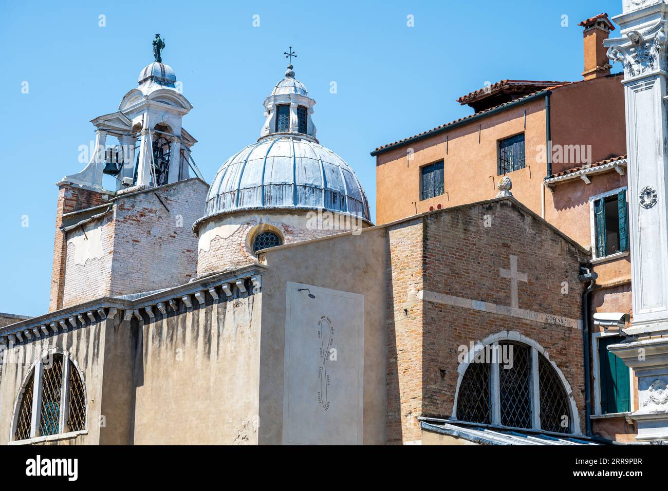 View of the San Giacomo di Rialto church on a summer day with blue sky ...
