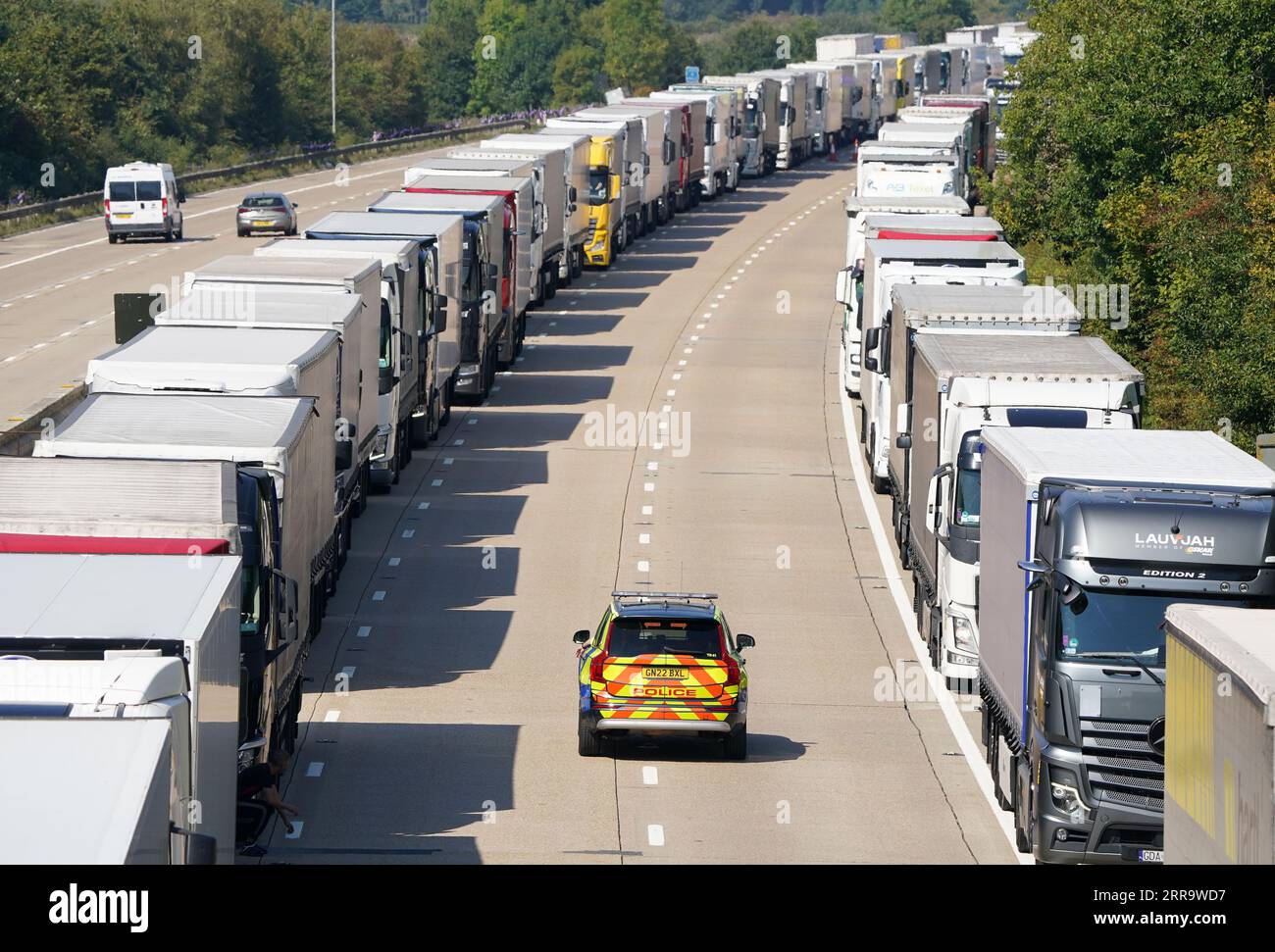 Lorries queue for the Port of Dover along the M20 near Ashford in Kent ...