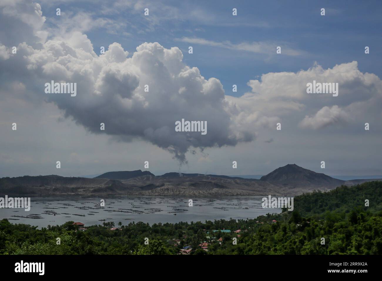 210705 -- BATANGAS, July 5, 2021 -- The Taal volcano emits a plume of ...
