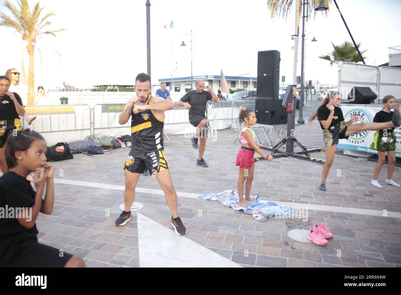 The images depict an animated children's kickboxing class in Italy at a ...