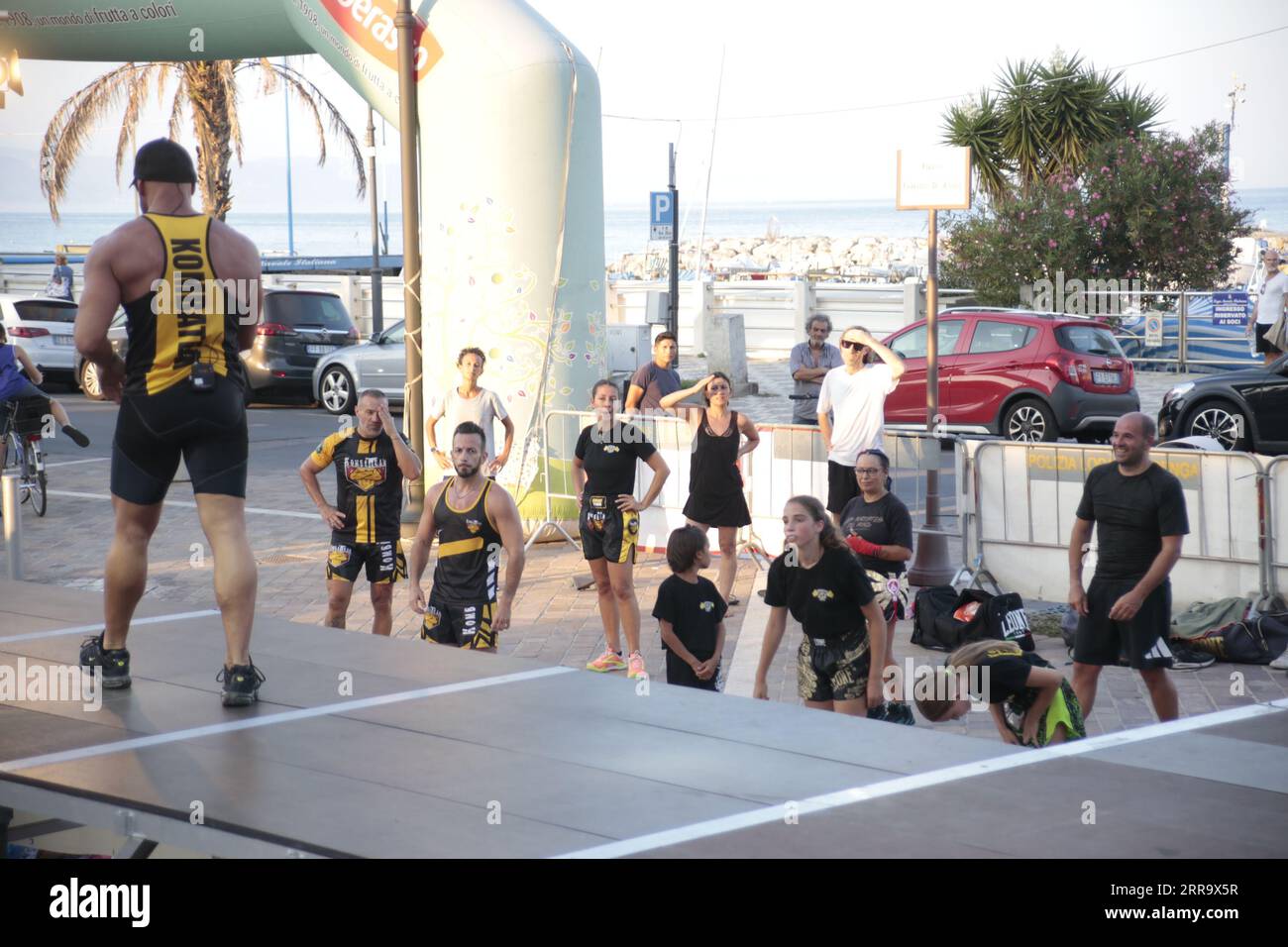 The images depict an animated children's kickboxing class in Italy at a ...