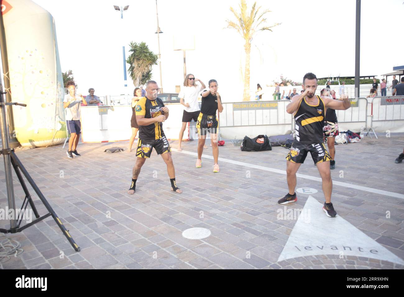 The images depict an animated children's kickboxing class in Italy at a ...
