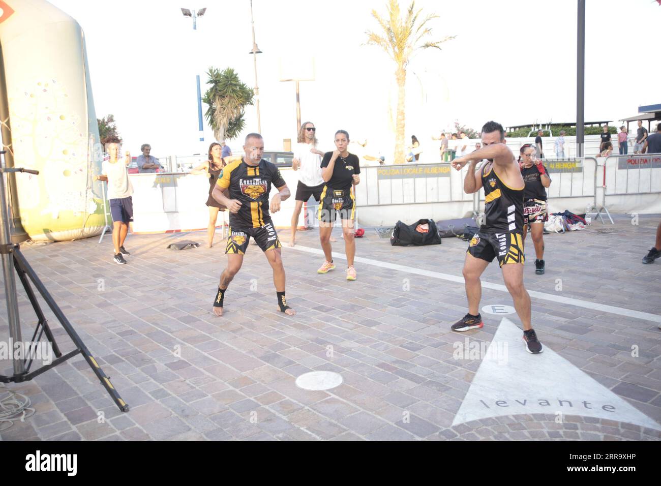 The images depict an animated children's kickboxing class in Italy at a ...