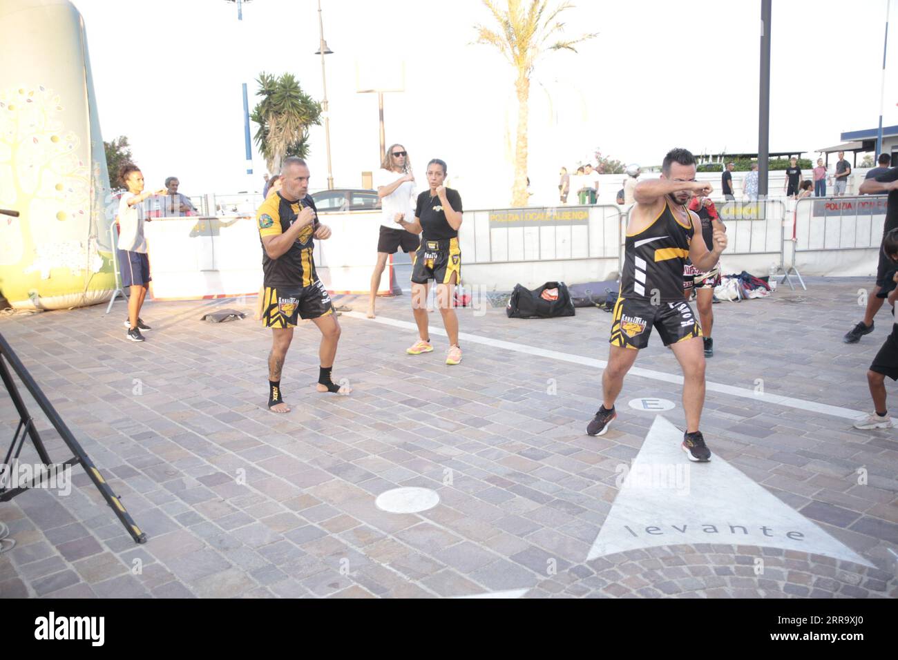 The images depict an animated children's kickboxing class in Italy at a ...