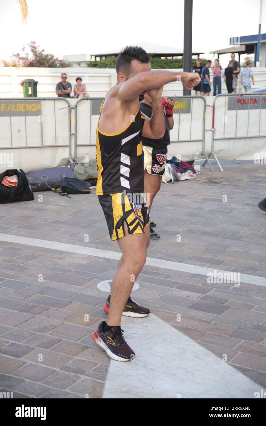 The images depict an animated children's kickboxing class in Italy at a ...