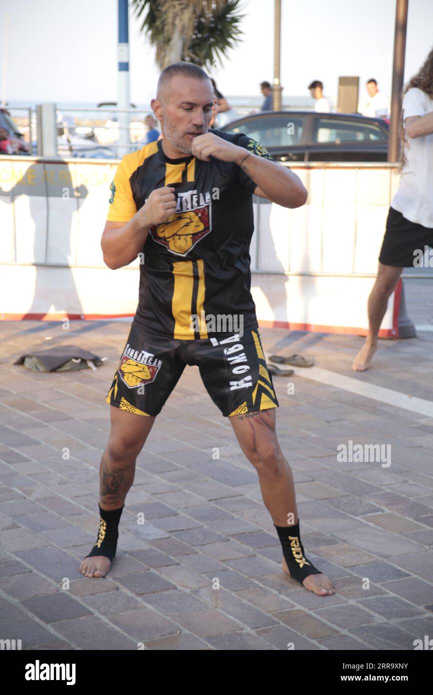 The images depict an animated children's kickboxing class in Italy at a ...