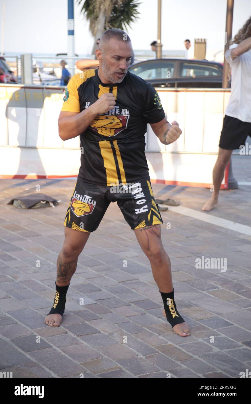 The images depict an animated children's kickboxing class in Italy at a ...