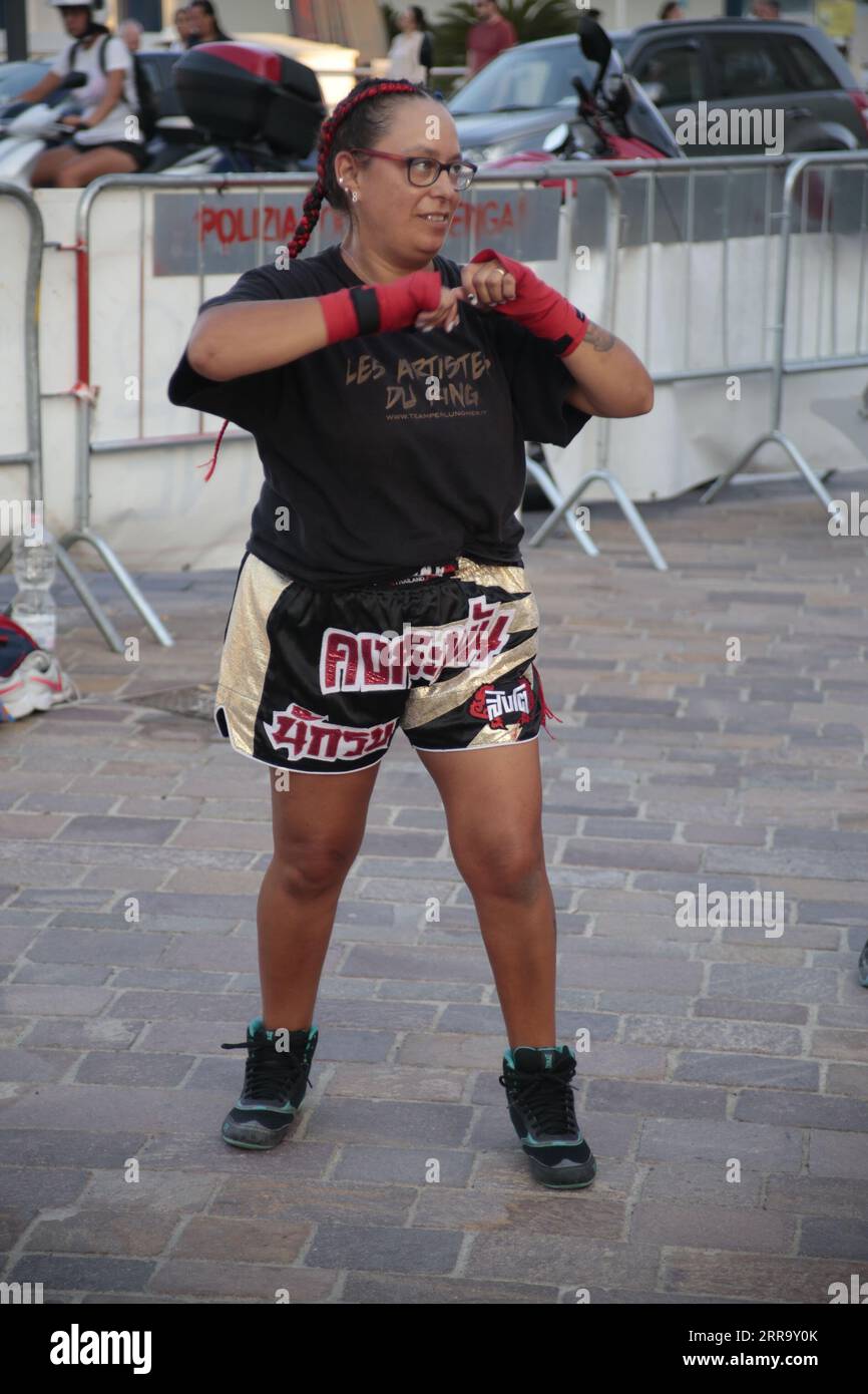 The images depict an animated children's kickboxing class in Italy at a ...