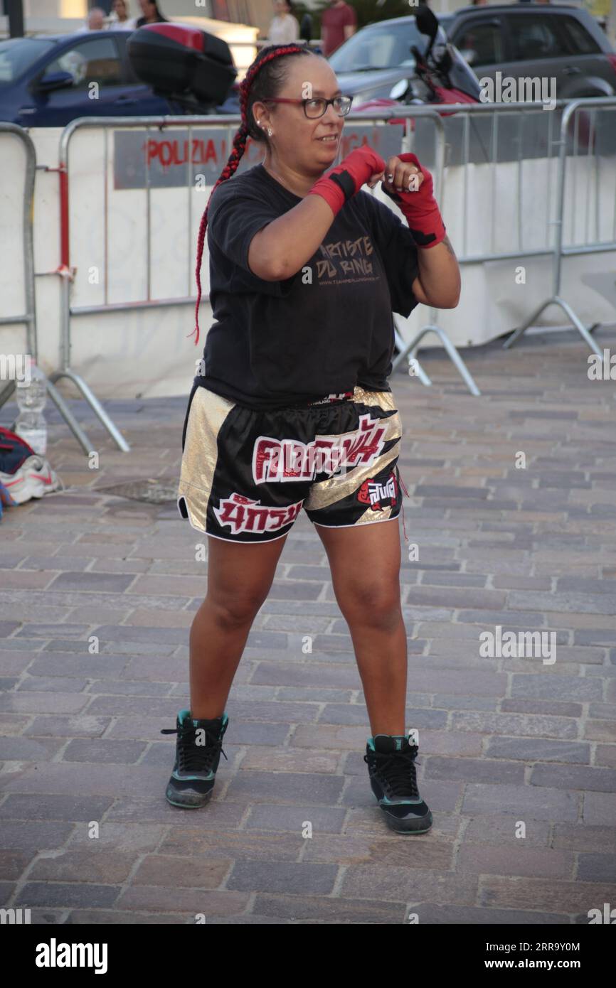 The images depict an animated children's kickboxing class in Italy at a ...