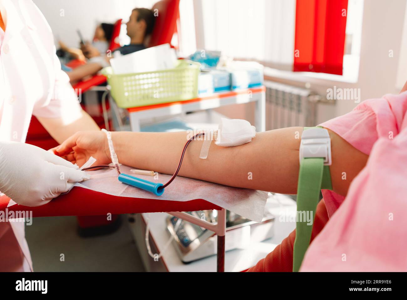 Woman donating blood in hospital hi-res stock photography and images ...