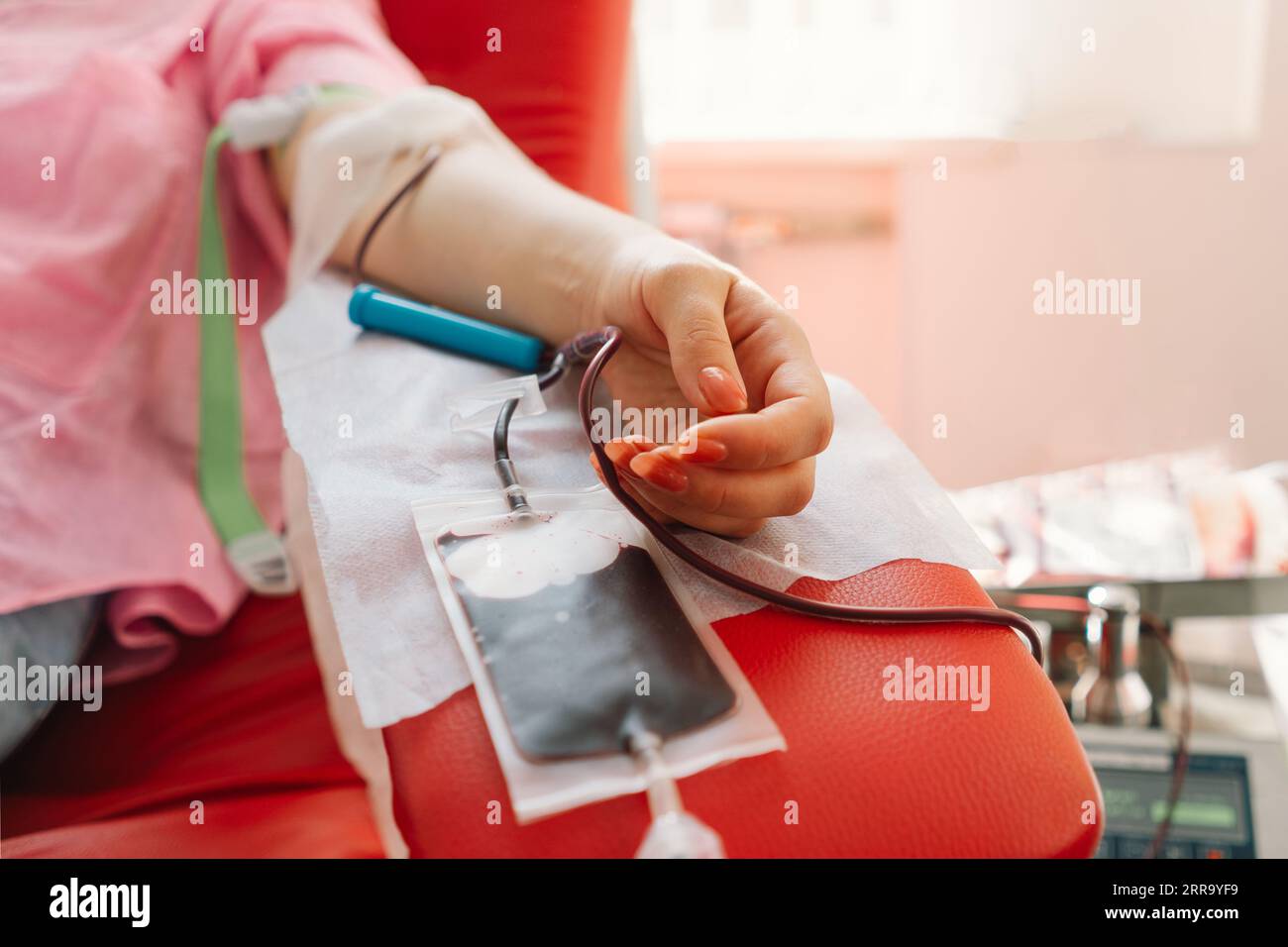 Young woman making blood donation in hospital Stock Photo - Alamy