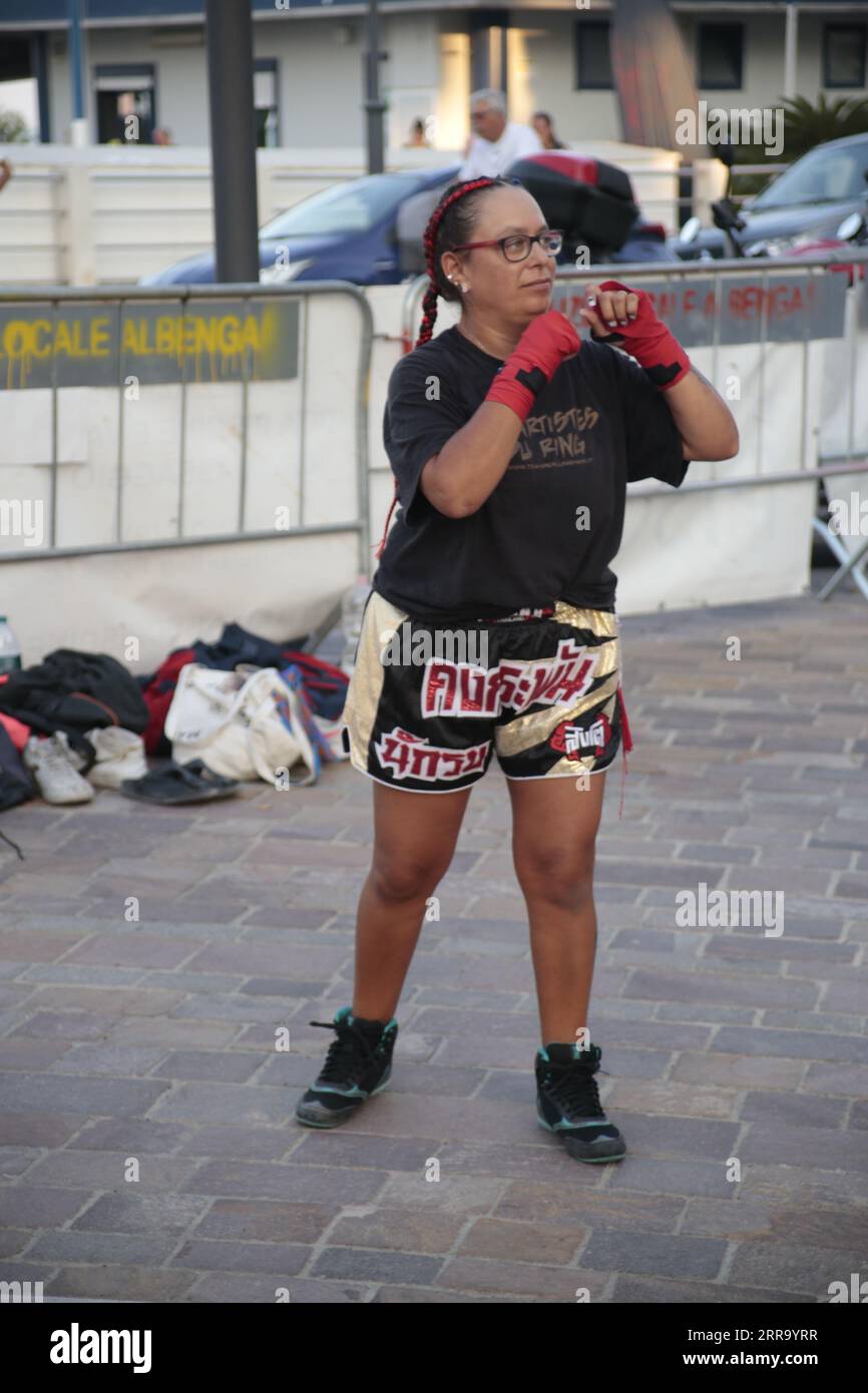 The images depict an animated children's kickboxing class in Italy at a ...