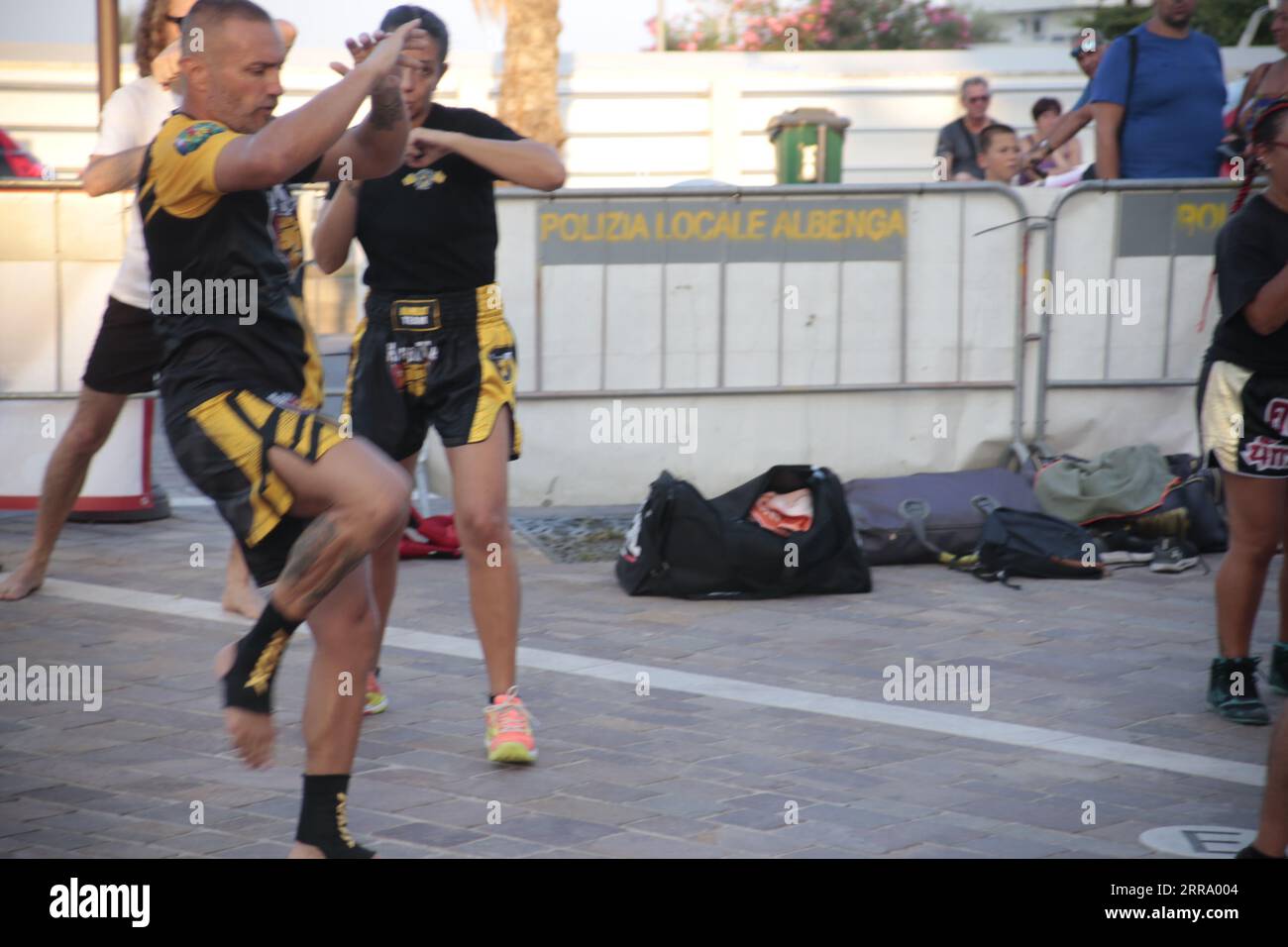 The images depict an animated children's kickboxing class in Italy at a ...