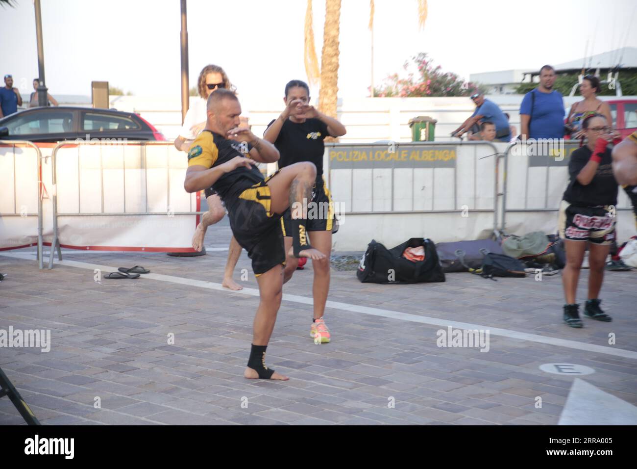 The images depict an animated children's kickboxing class in Italy at a ...