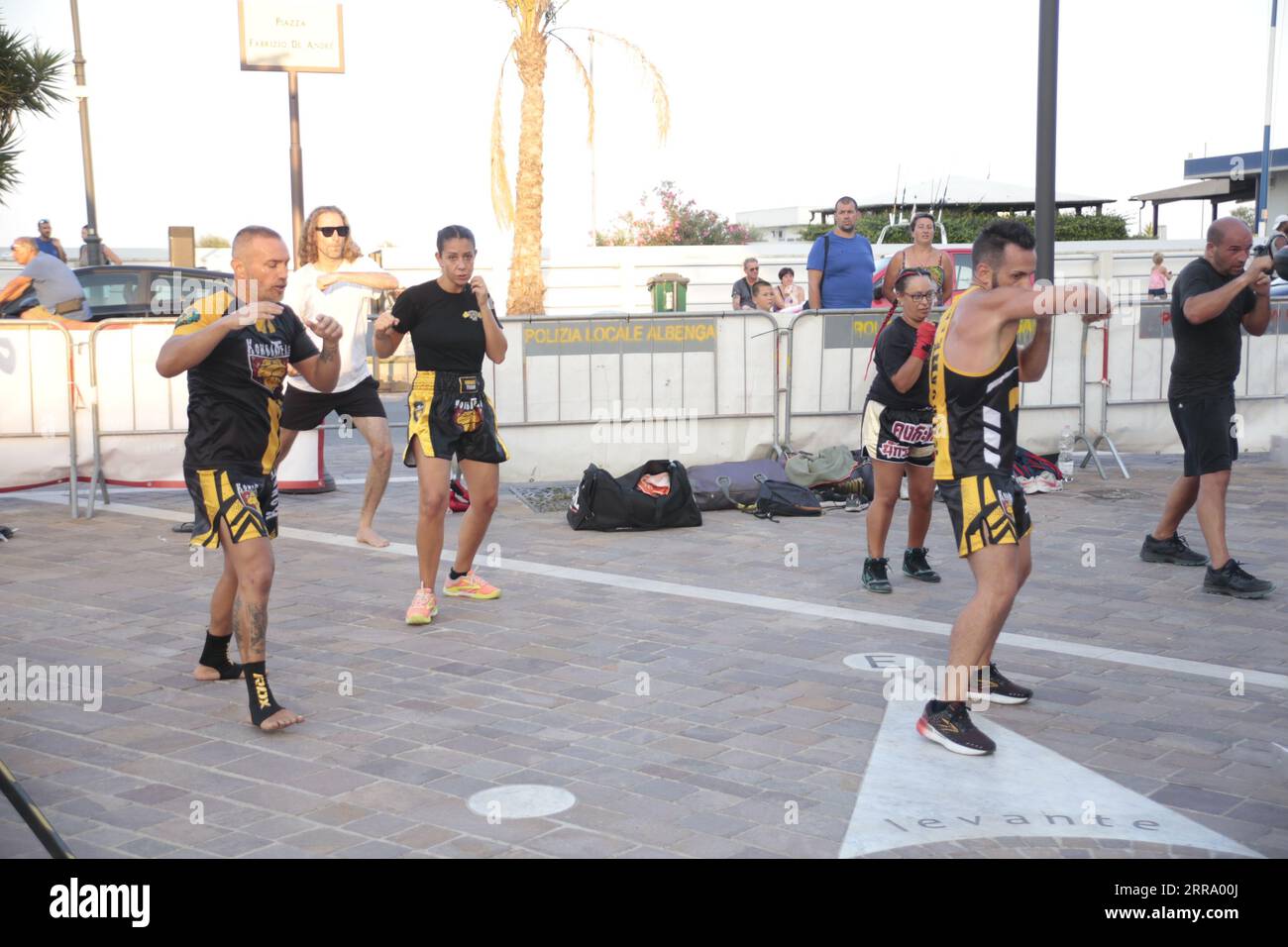 The images depict an animated children's kickboxing class in Italy at a ...