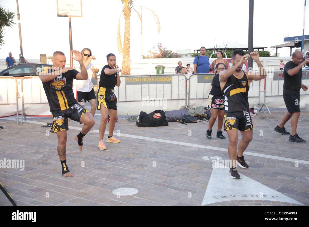 The images depict an animated children's kickboxing class in Italy at a ...