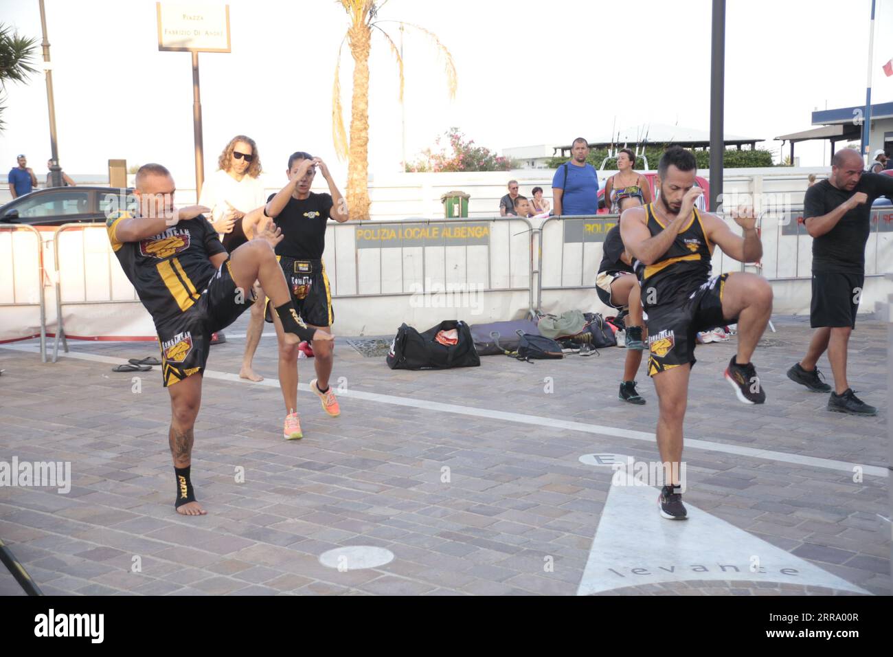 The images depict an animated children's kickboxing class in Italy at a ...