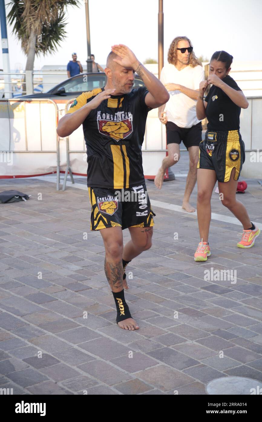 The images depict an animated children's kickboxing class in Italy at a ...
