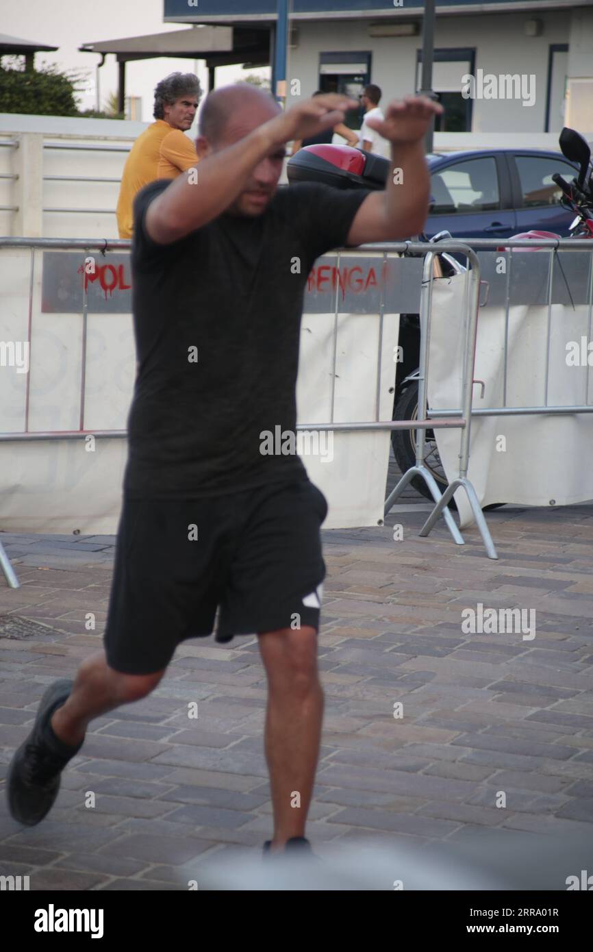 The images depict an animated children's kickboxing class in Italy at a ...