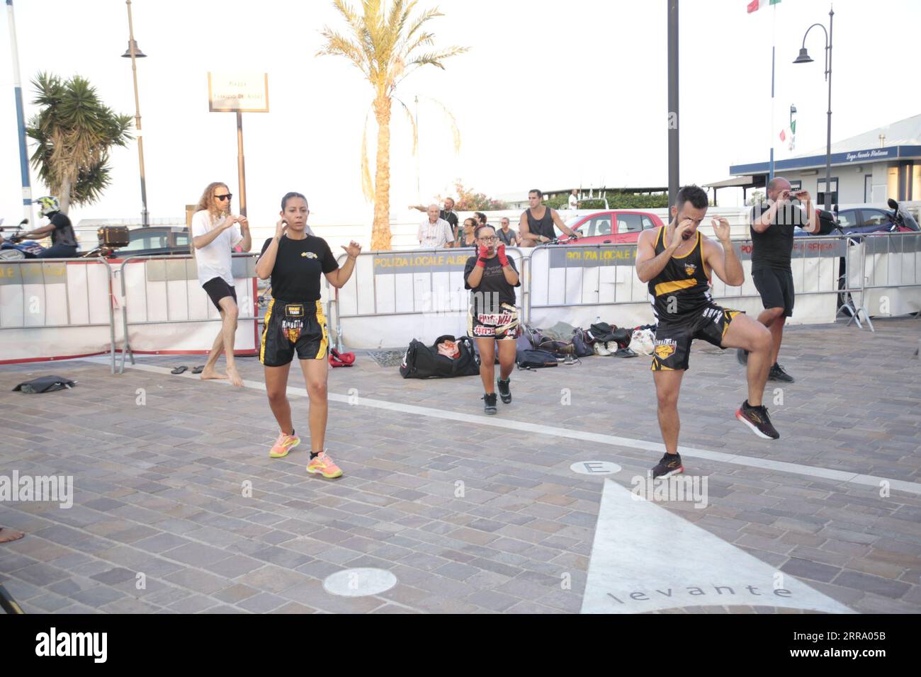 The images depict an animated children's kickboxing class in Italy at a ...