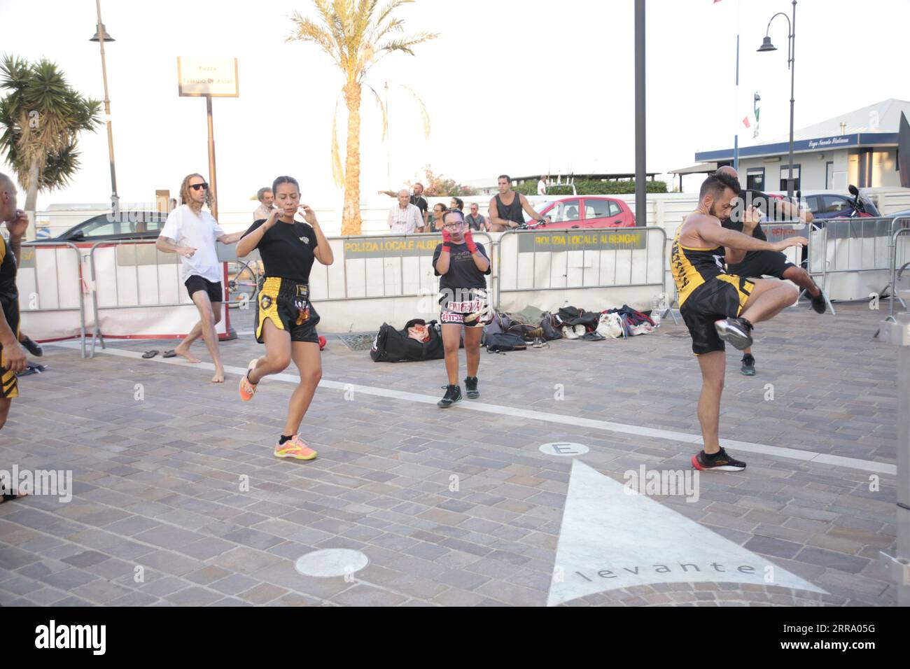 The images depict an animated children's kickboxing class in Italy at a ...