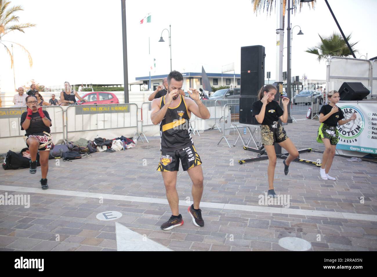 The images depict an animated children's kickboxing class in Italy at a ...