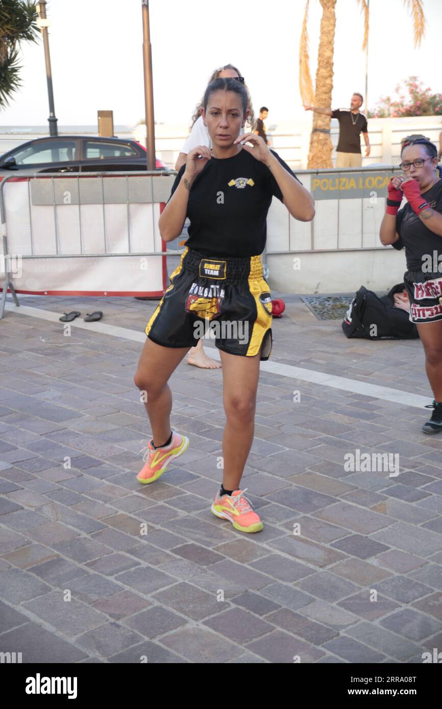 The images depict an animated children's kickboxing class in Italy at a ...