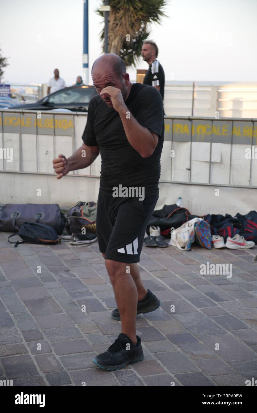 The images depict an animated children's kickboxing class in Italy at a ...