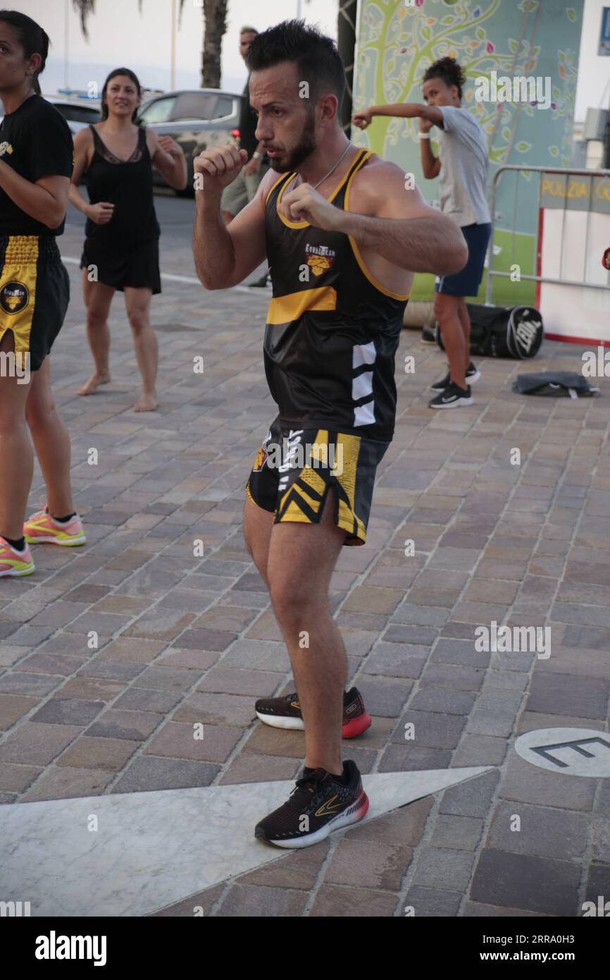 The images depict an animated children's kickboxing class in Italy at a ...