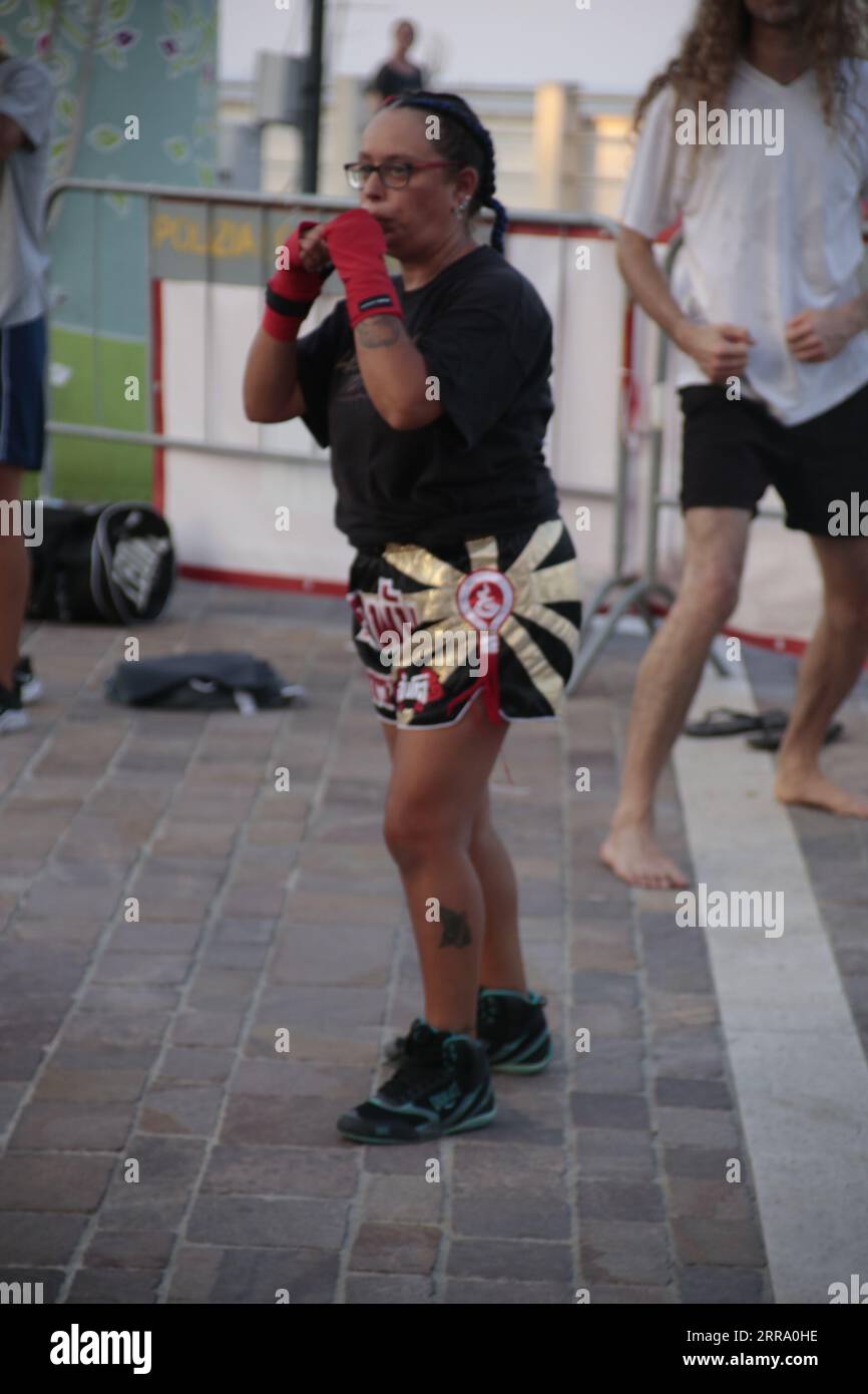 The images depict an animated children's kickboxing class in Italy at a ...