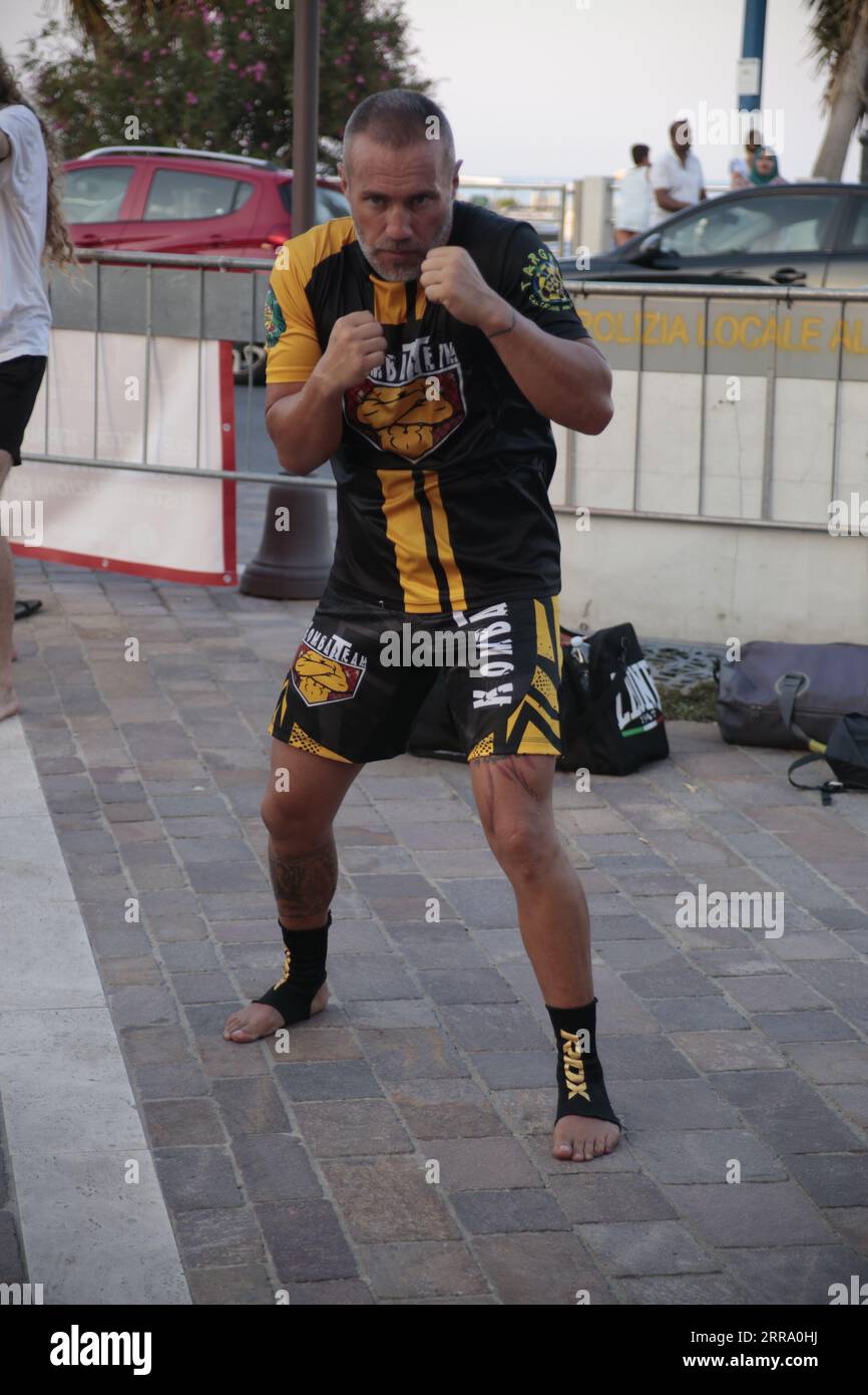 The images depict an animated children's kickboxing class in Italy at a ...
