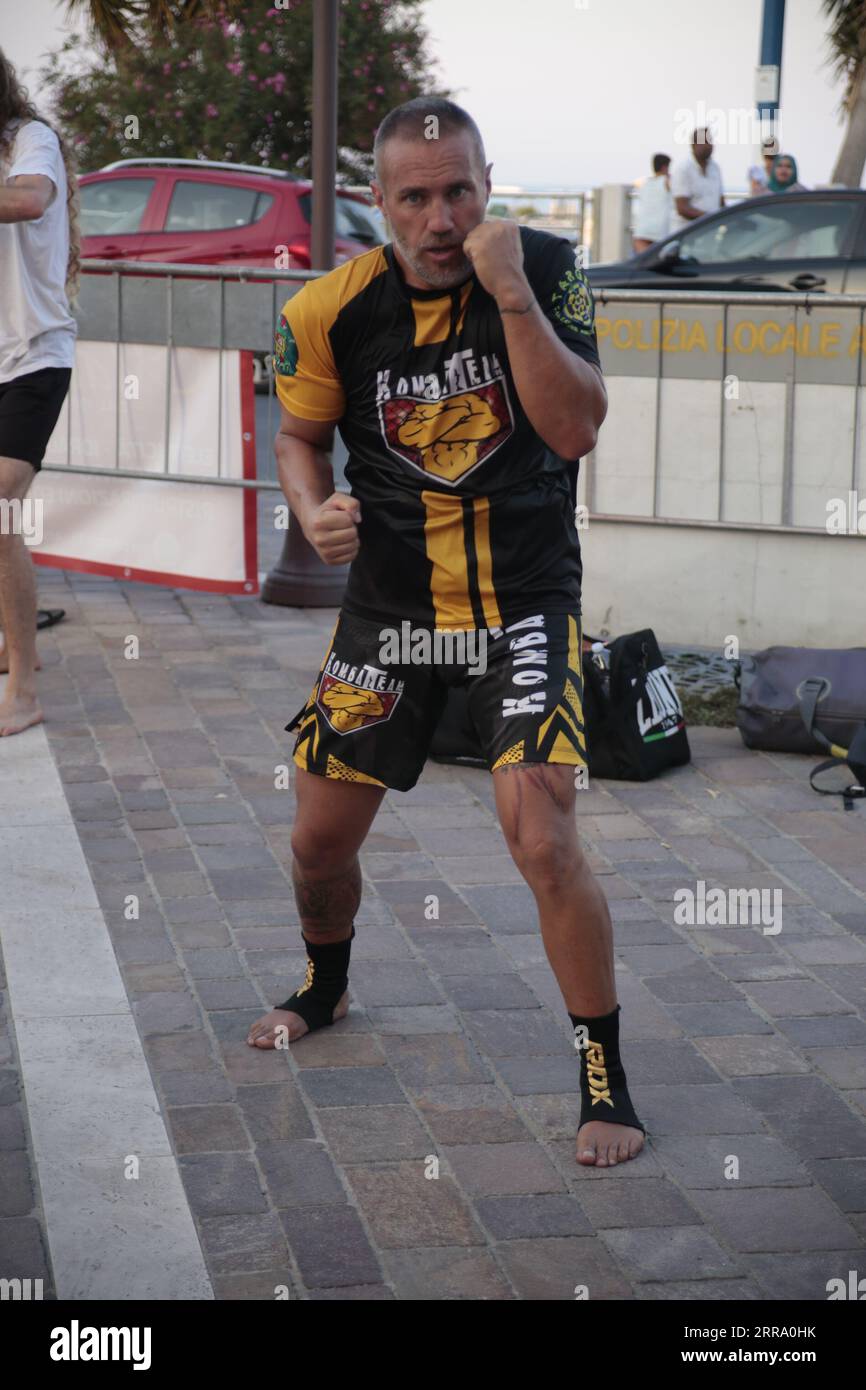 The images depict an animated children's kickboxing class in Italy at a ...