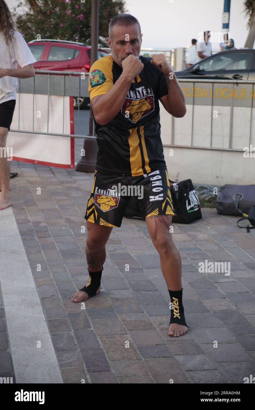 The images depict an animated children's kickboxing class in Italy at a ...