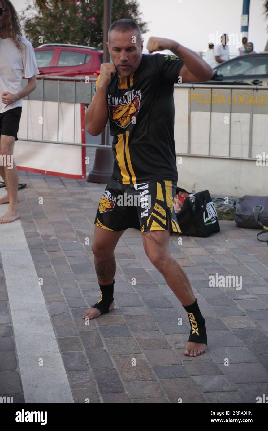 The images depict an animated children's kickboxing class in Italy at a ...