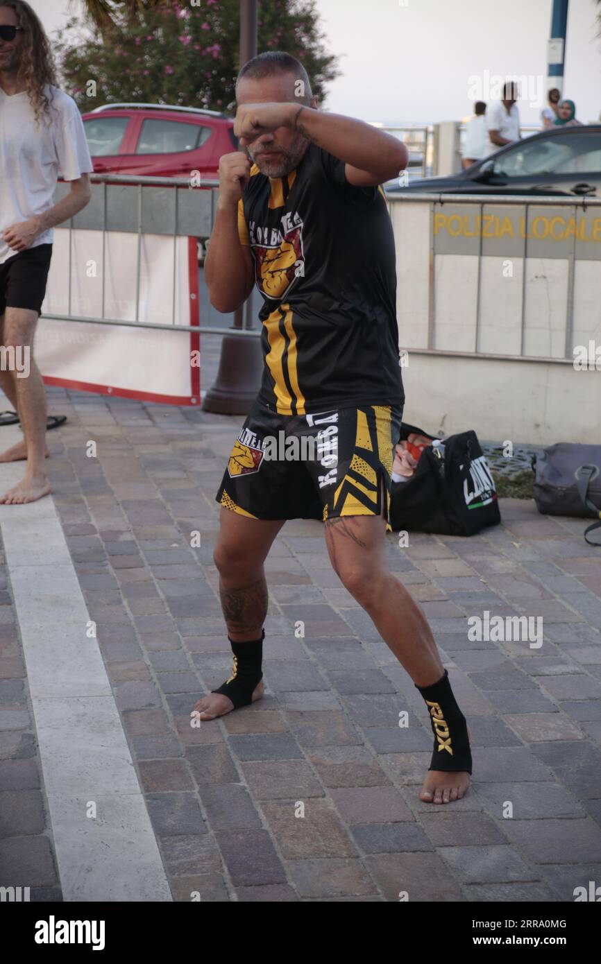 The images depict an animated children's kickboxing class in Italy at a ...