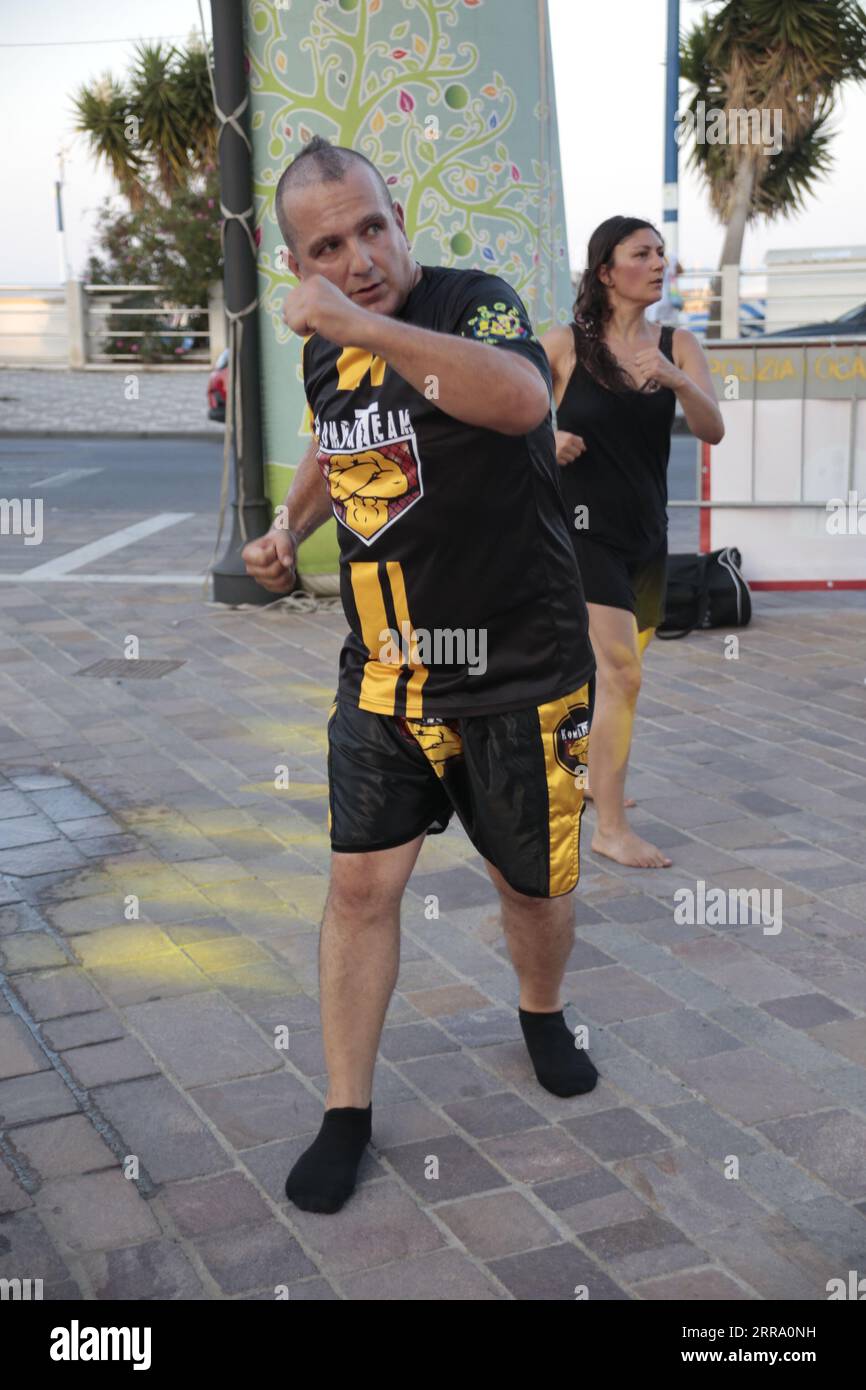 The images depict an animated children's kickboxing class in Italy at a ...