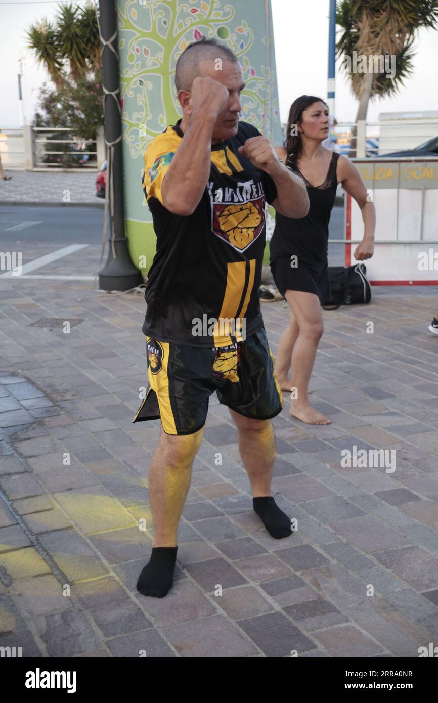 The images depict an animated children's kickboxing class in Italy at a ...