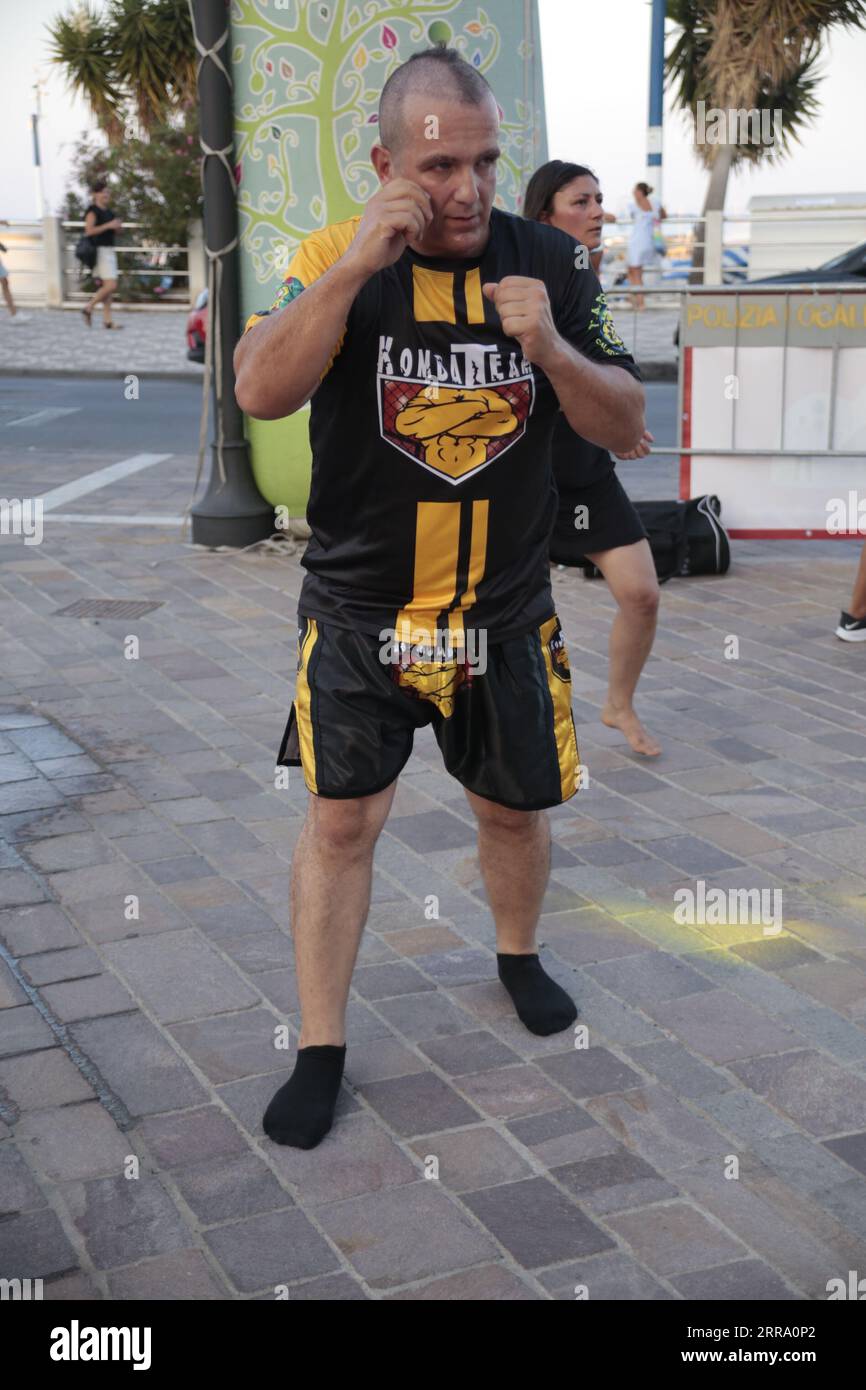 The images depict an animated children's kickboxing class in Italy at a ...
