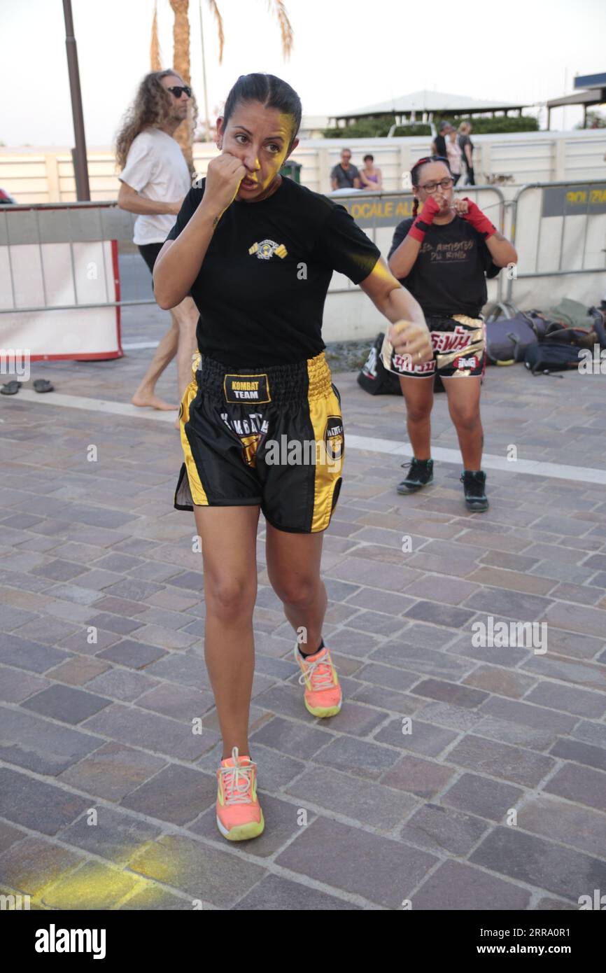 The images depict an animated children's kickboxing class in Italy at a ...
