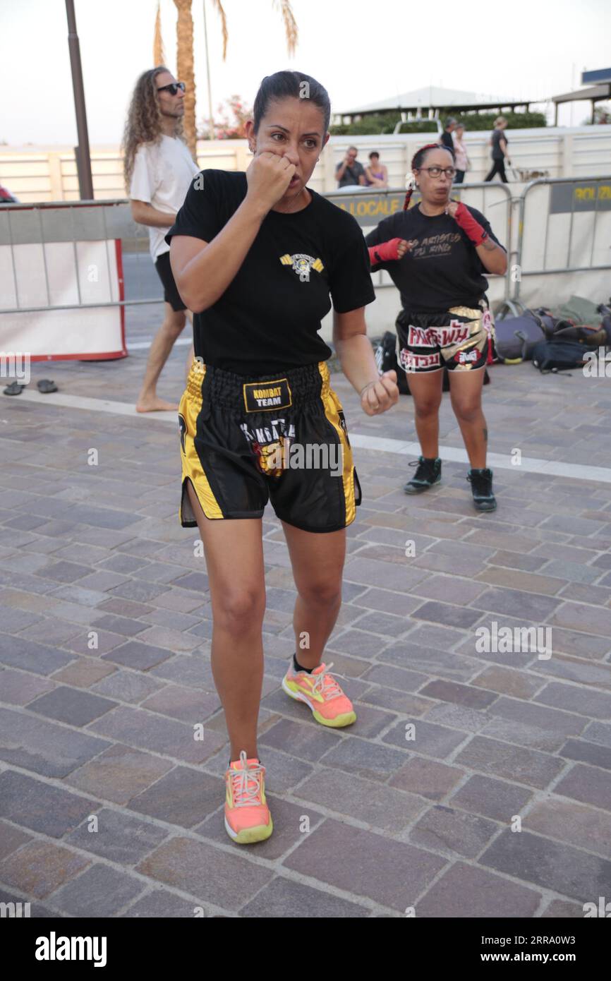 The images depict an animated children's kickboxing class in Italy at a ...