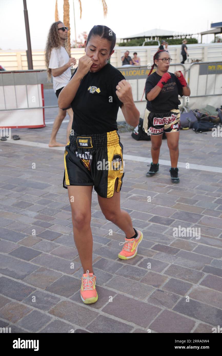 The images depict an animated children's kickboxing class in Italy at a ...