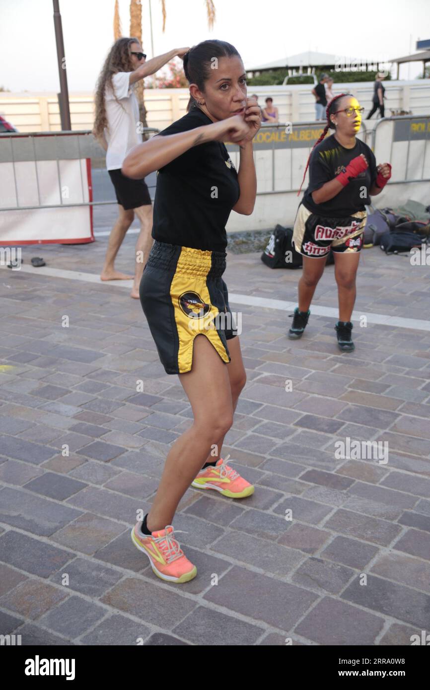 The images depict an animated children's kickboxing class in Italy at a ...