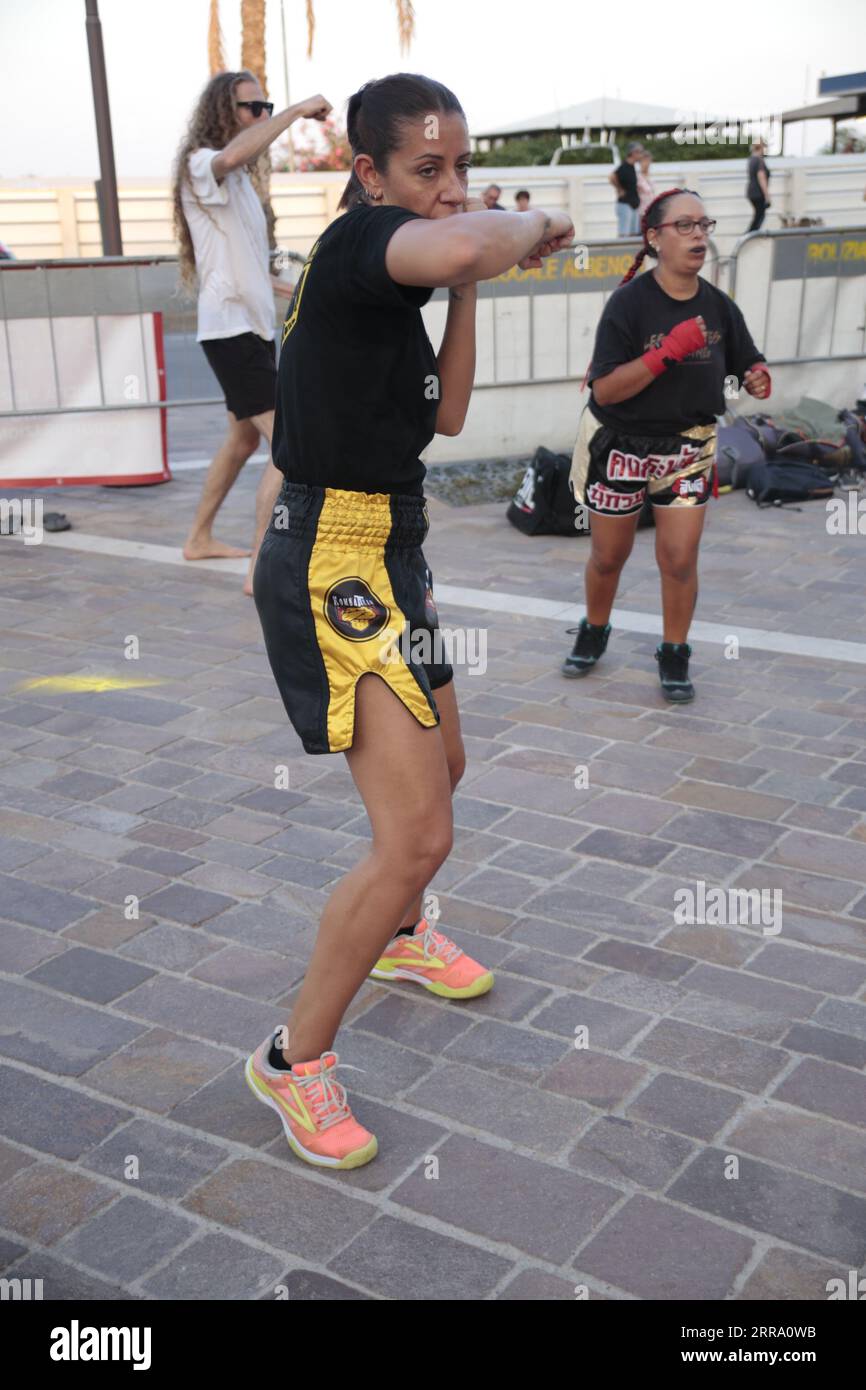 The images depict an animated children's kickboxing class in Italy at a ...